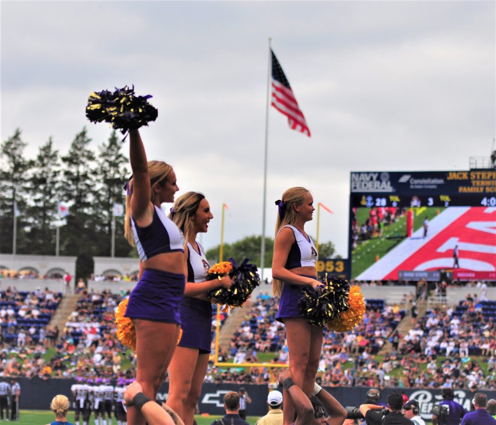 Pirate cheerleaders lend their support as Old Glory flies at Navy ...